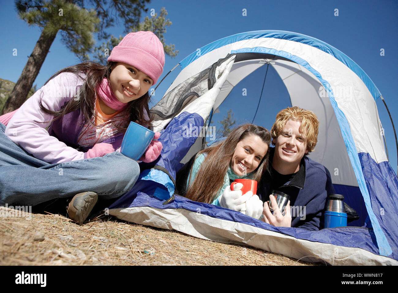Group friends drinking outside tent hi-res stock photography and images ...