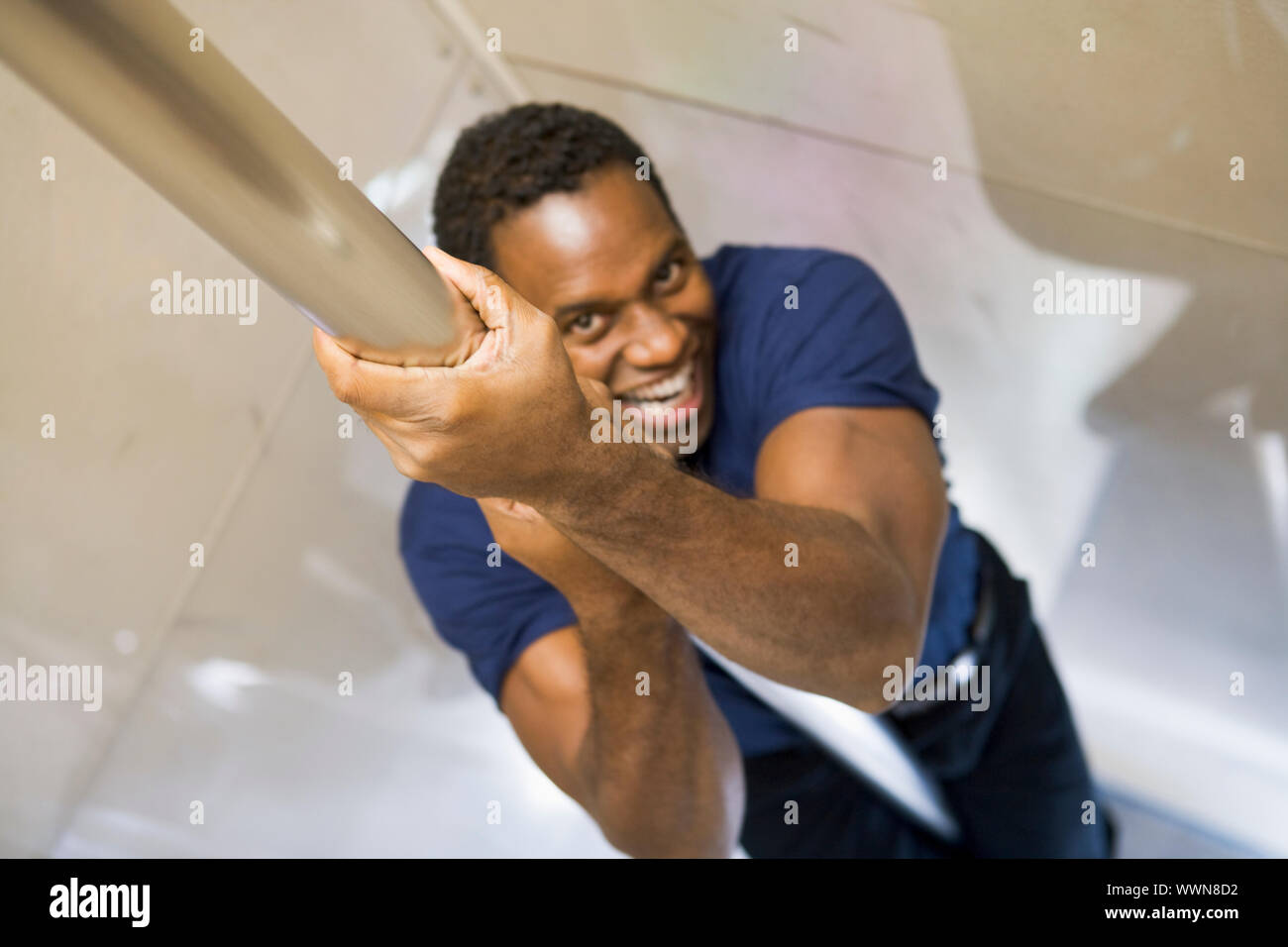 A firefighter sliding down the fireman's pole Stock Photo - Alamy