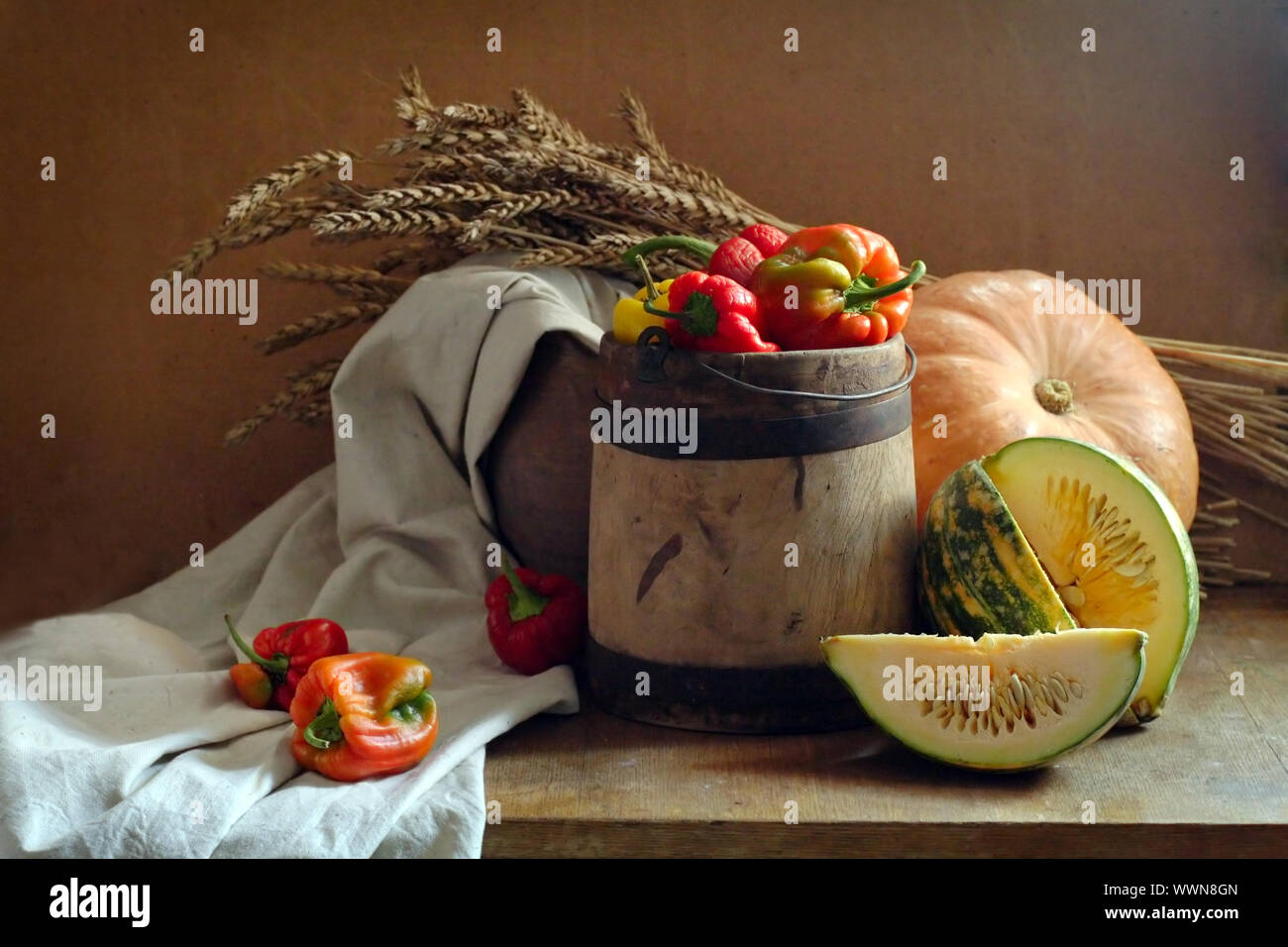 rustic still life of vegetables and wheat sunlit Stock Photo - Alamy