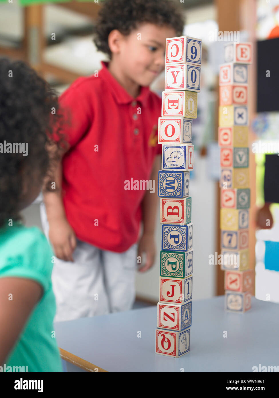 Kids playing blocks stacked hi-res stock photography and images - Alamy