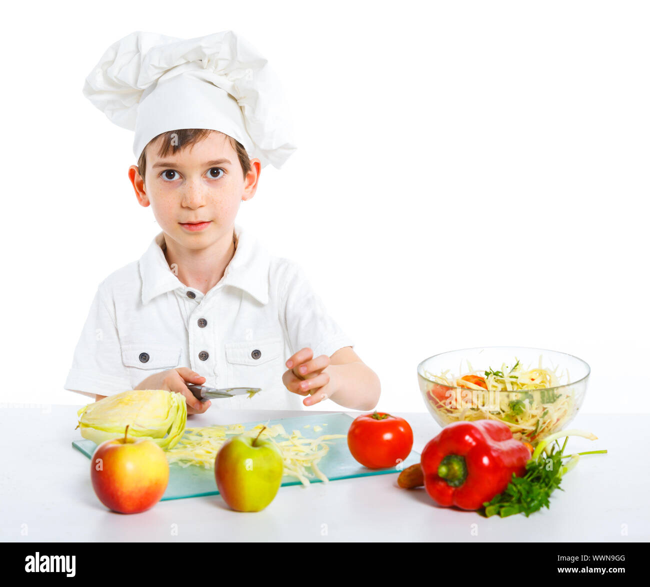 Little cook tasty salad, isolated on white Stock Photo - Alamy