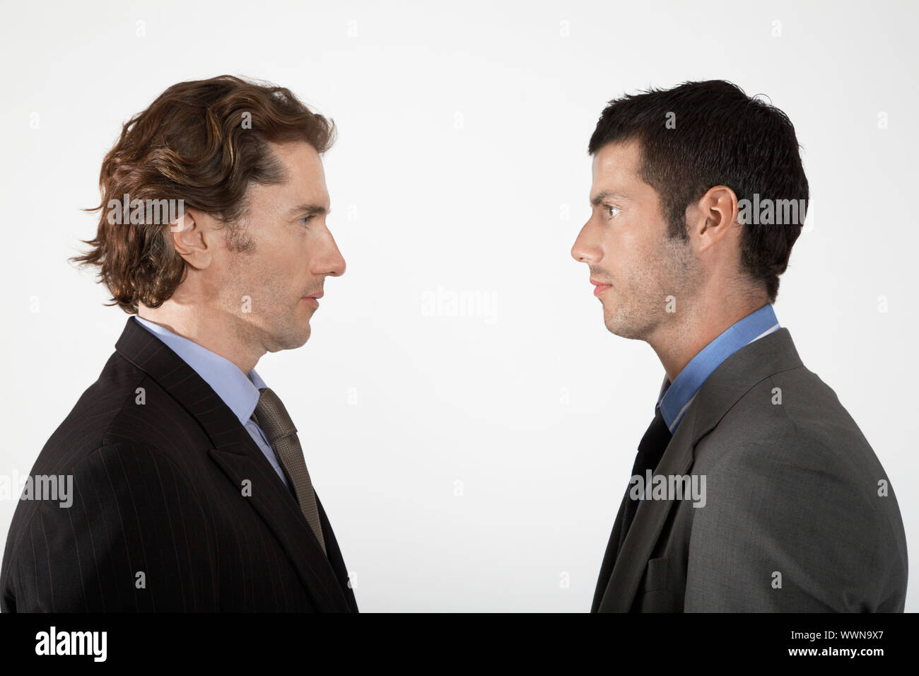 Businessmen Standing Face to Face Stock Photo - Alamy