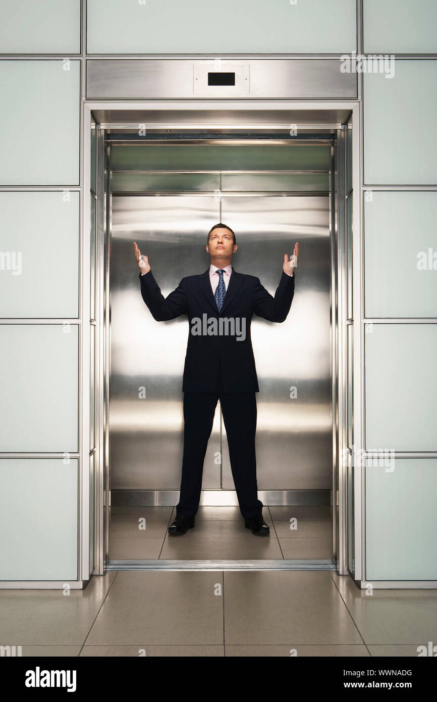 In elevator full body hi-res stock photography and images - Alamy