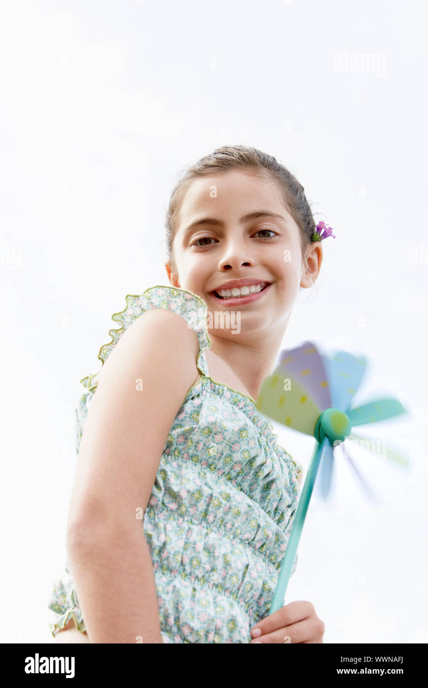 Little Girl Holding a Pinwheel Stock Photo - Alamy
