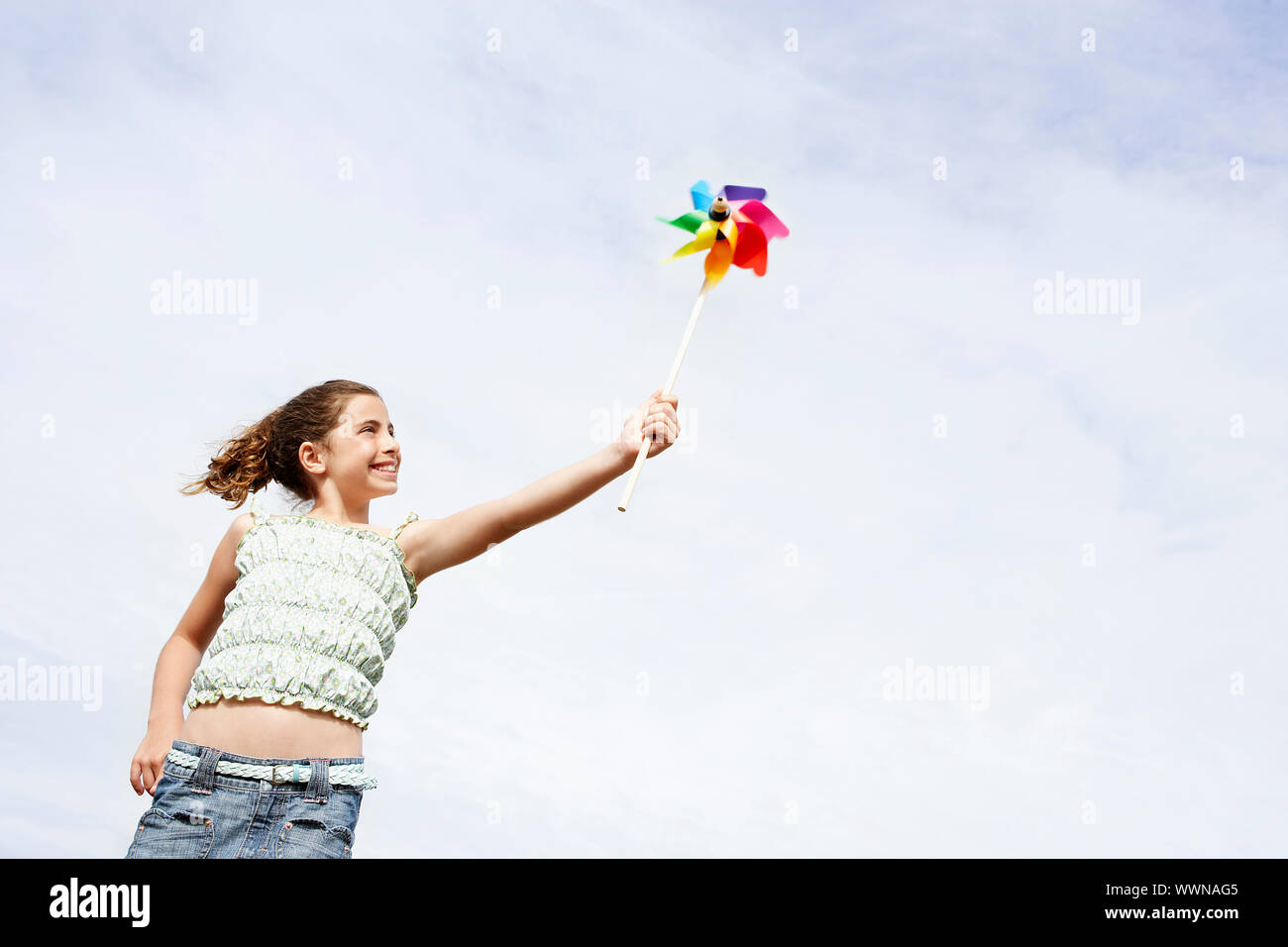 Little Girl Holding a Pinwheel Stock Photo - Alamy