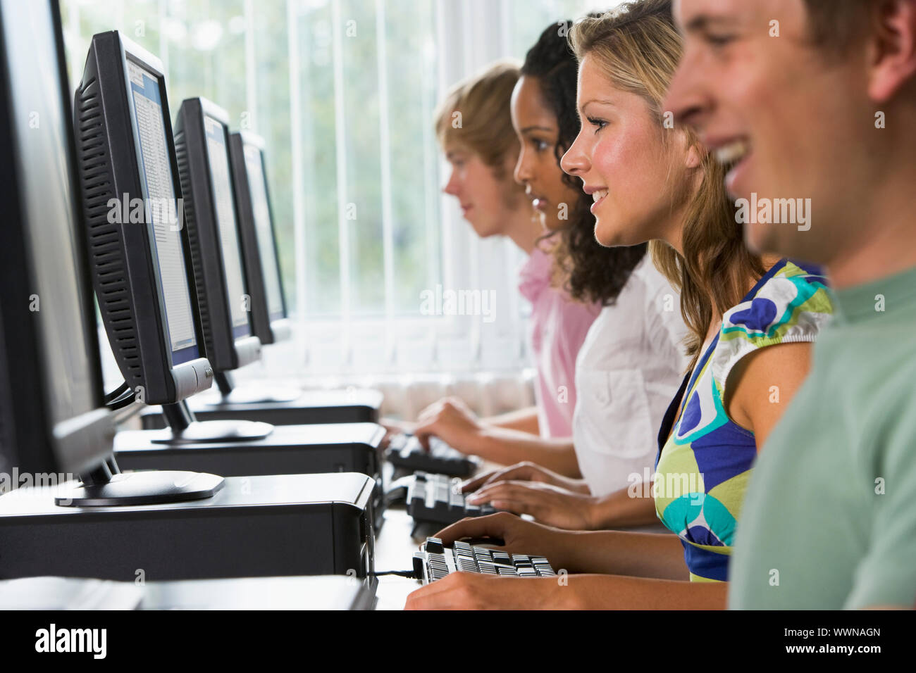 Young women students using computer lab hi-res stock photography and ...