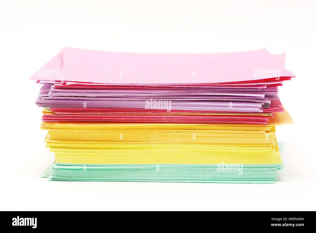 Batch of assorted color paper over white background Stock Photo - Alamy