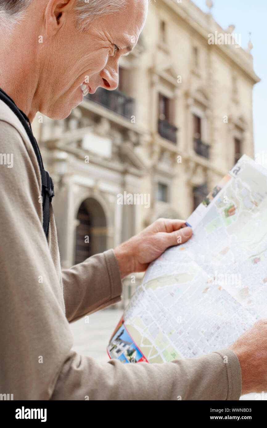 Tourist Reading Map Stock Photo - Alamy