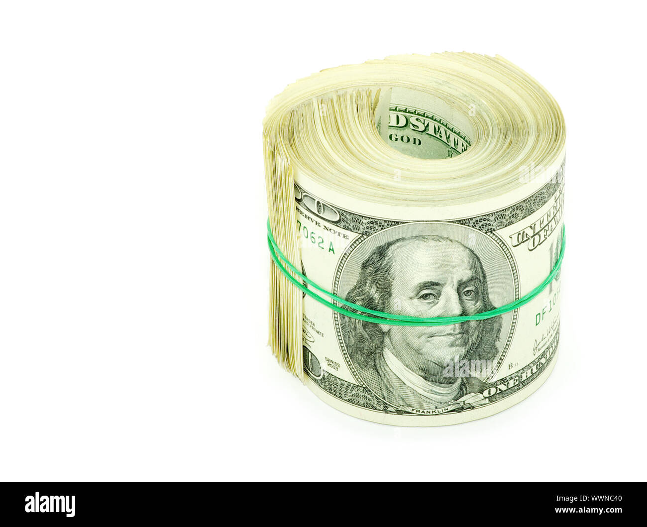 Roll of dollars close-up against white background Stock Photo - Alamy