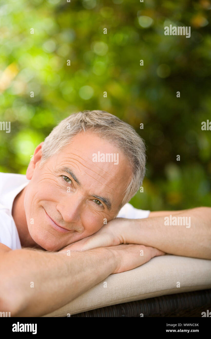 Older Man Relaxing Outdoors Stock Photo - Alamy