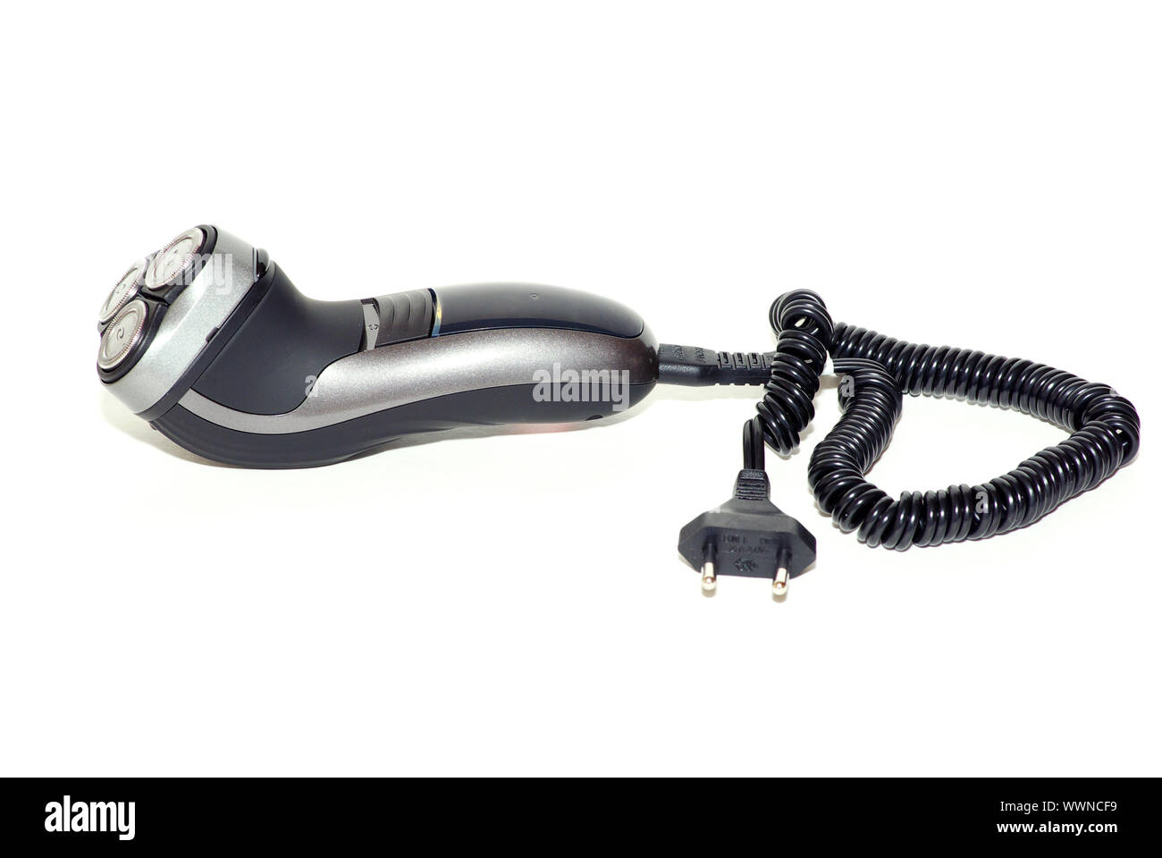 Close up on an electric razor laying sideways Stock Photo - Alamy