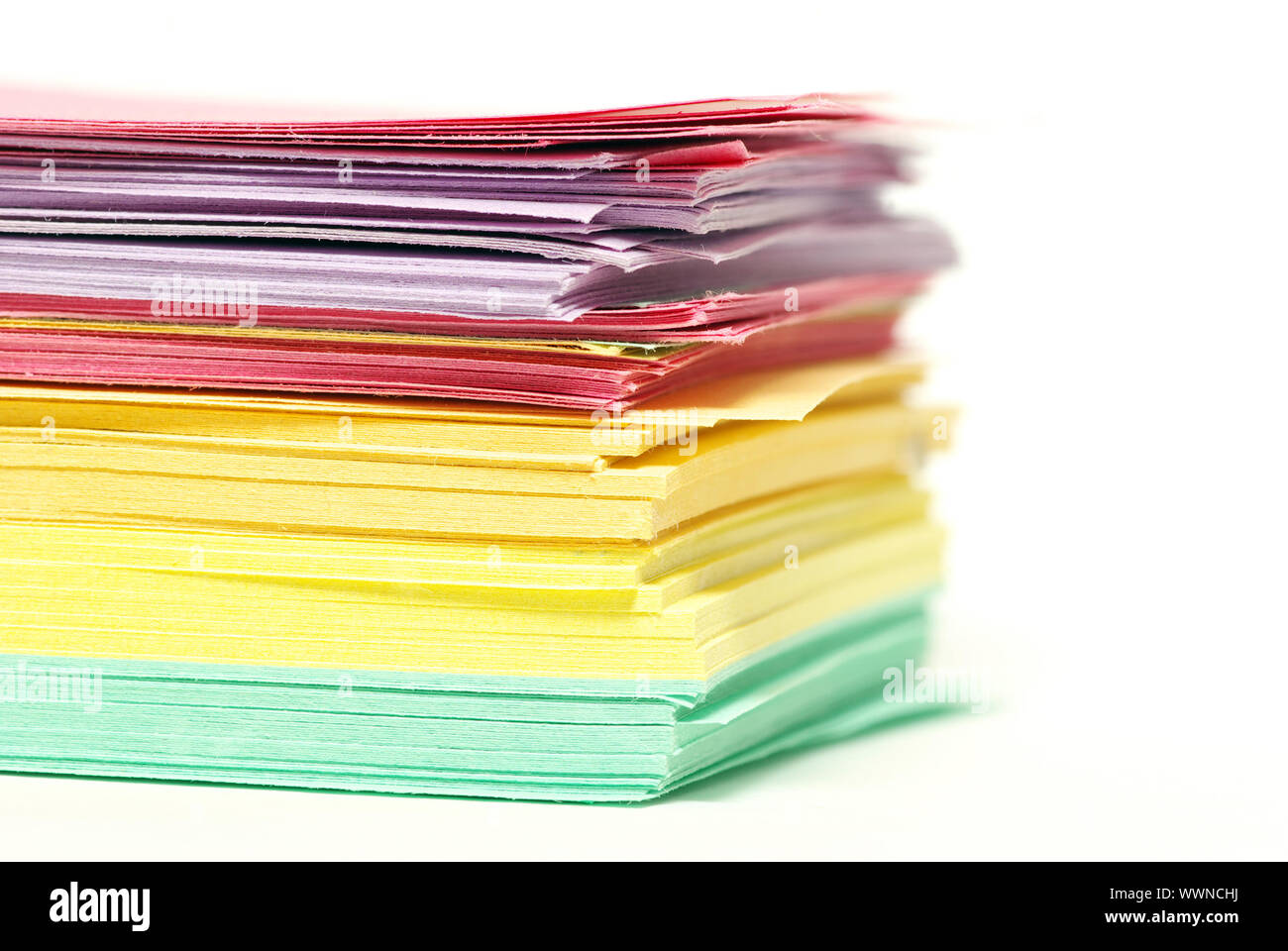 Batch of assorted color paper over white background Stock Photo - Alamy