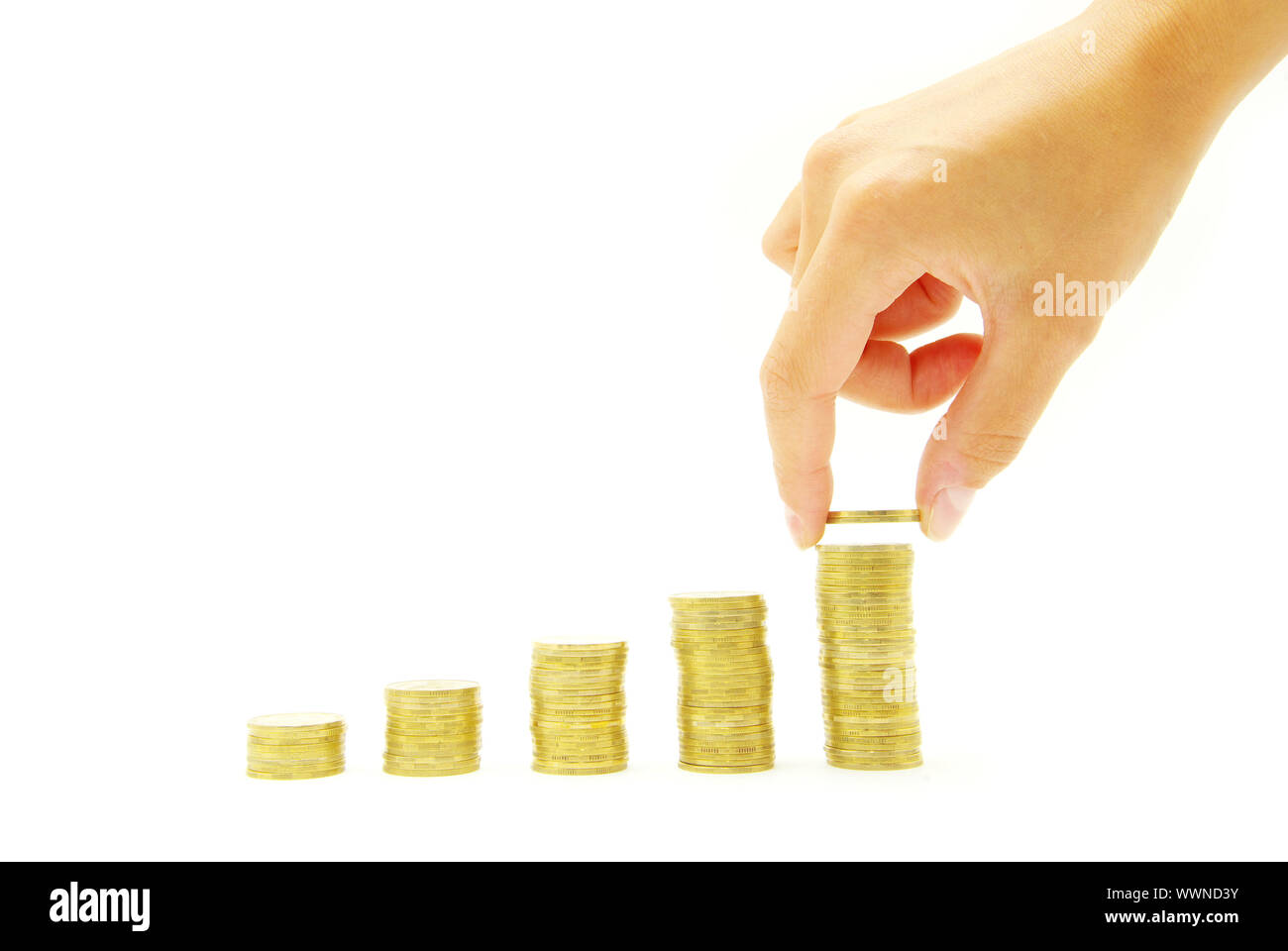 Hand put coin to money staircase isolated on white background Stock ...