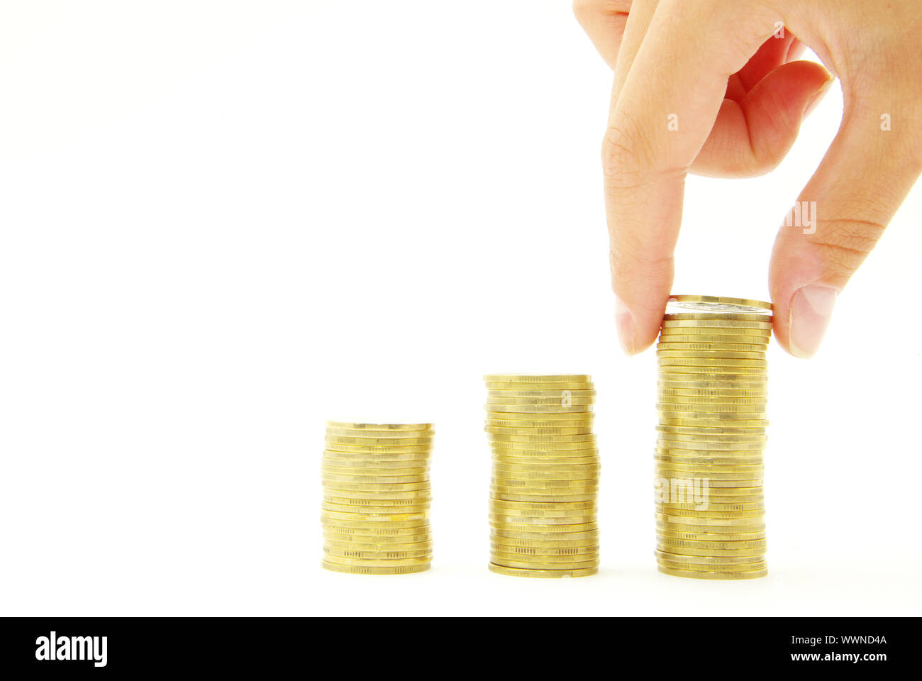 Hand put coin to money staircase isolated on white background Stock ...