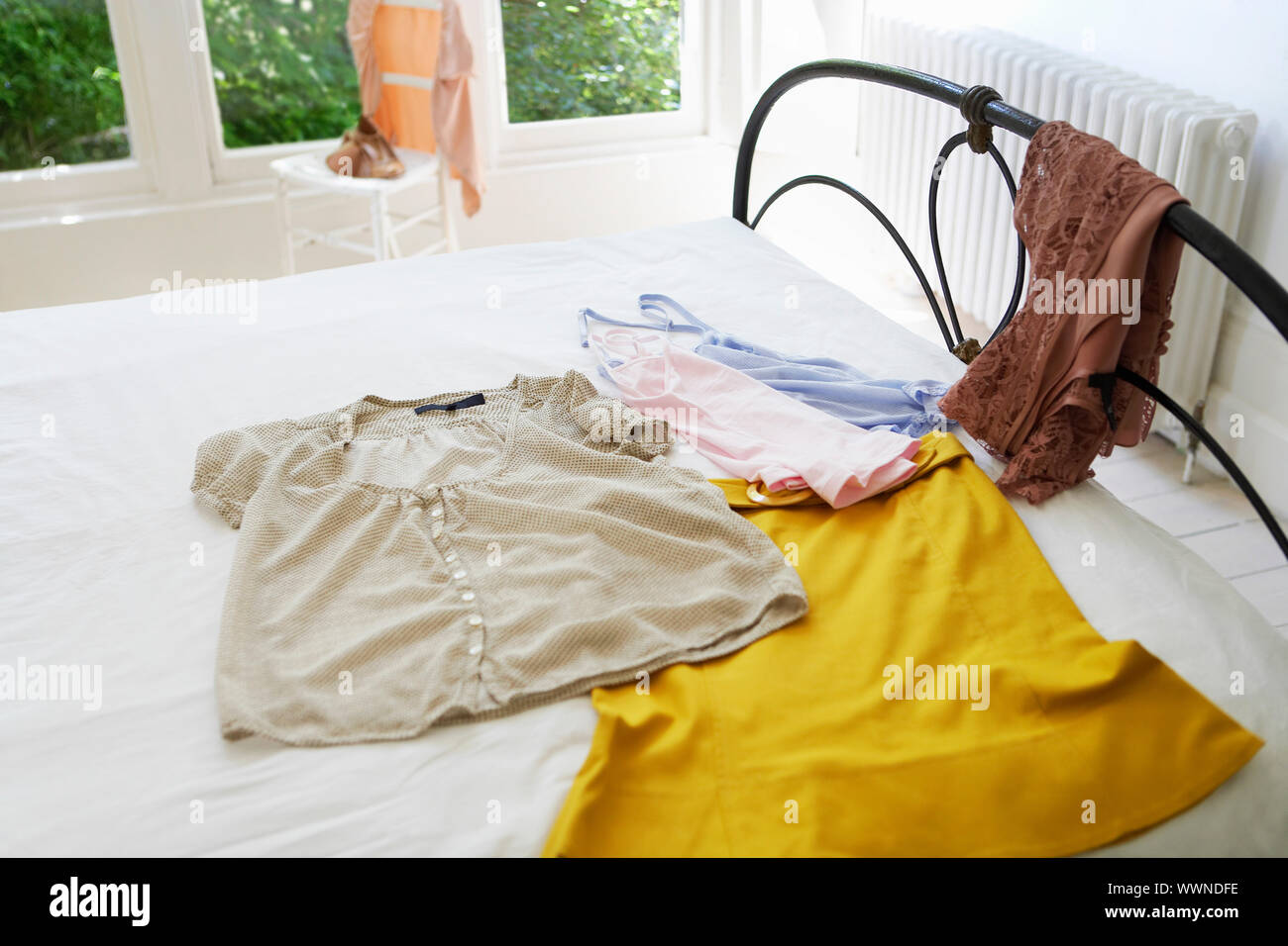 Outfit Laying Out on Bed Stock Photo - Alamy