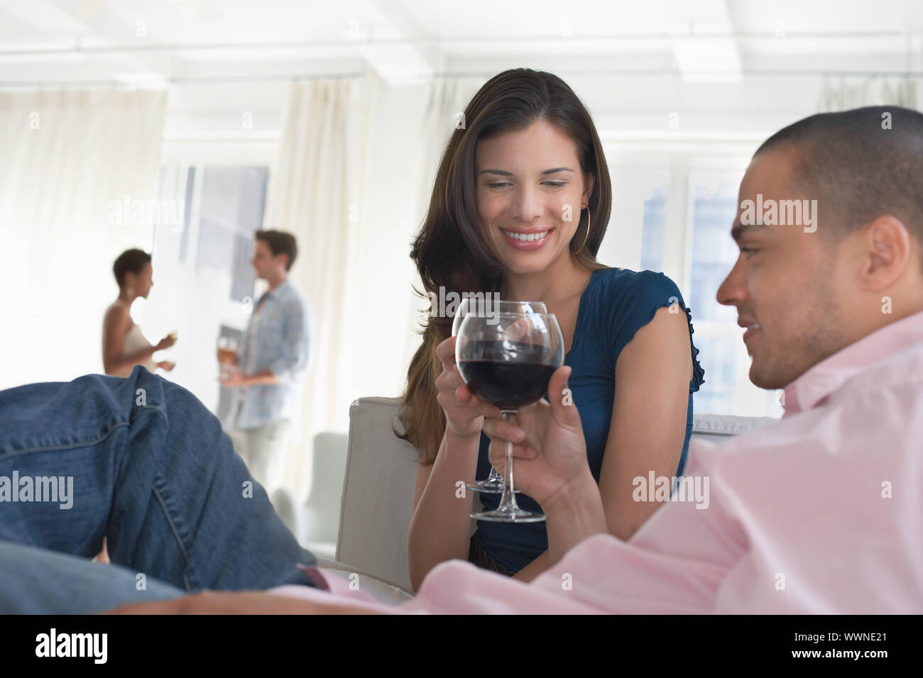 Couples Talking at a Party Stock Photo - Alamy