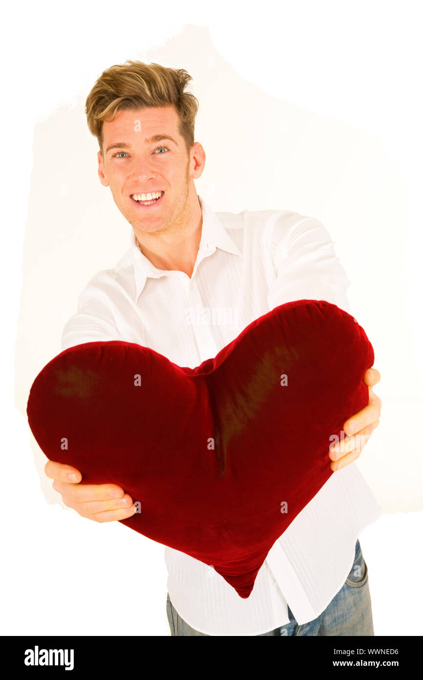 Man holding heart shaped pillow hi-res stock photography and images - Alamy