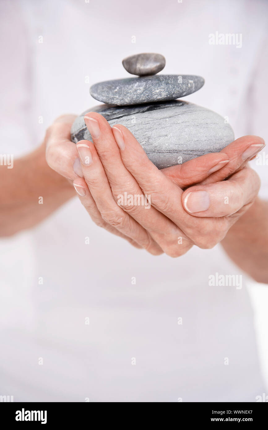 Woman Holding Stones Stock Photo - Alamy