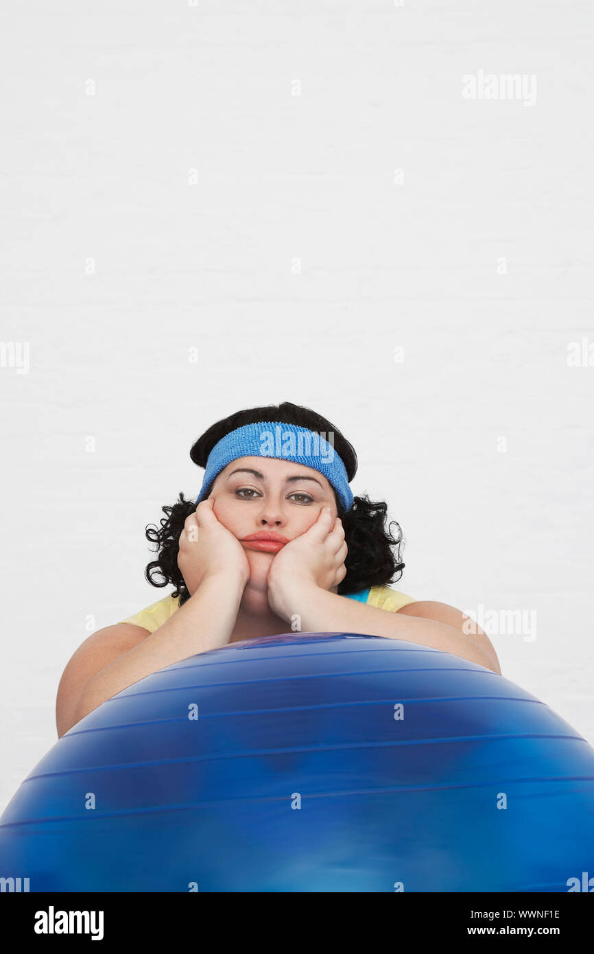Woman Resting on Exercise Ball Stock Photo - Alamy