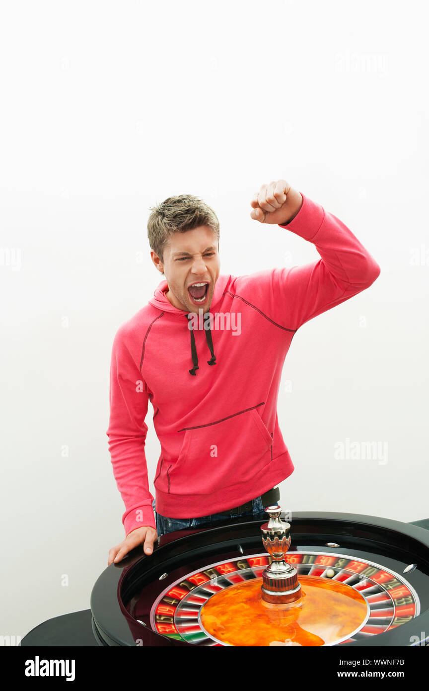 Excited young man reaching out hi-res stock photography and images - Alamy