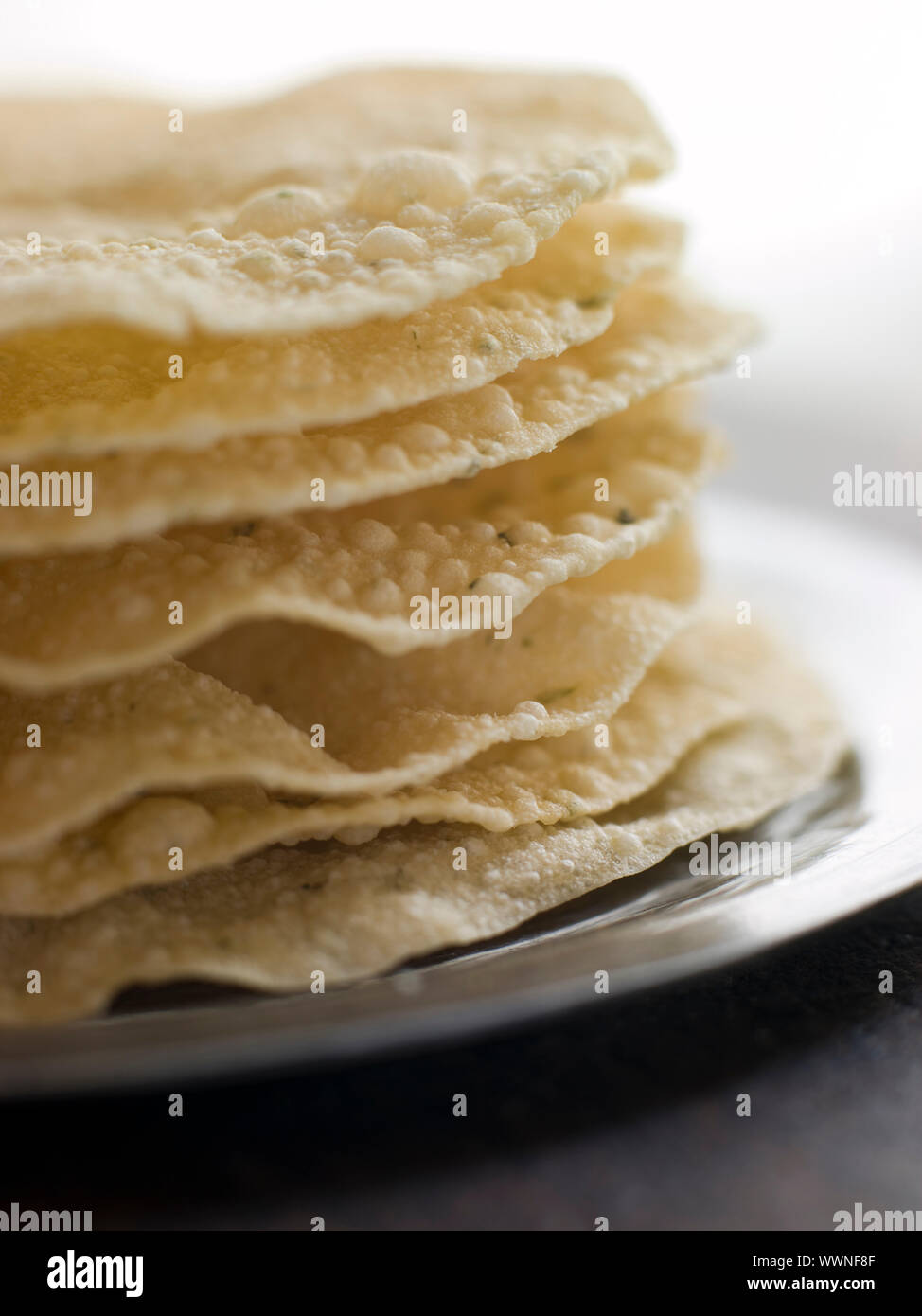 Close up of Stack of cooked Papadoms Stock Photo - Alamy