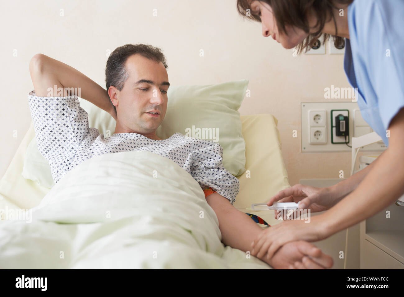 Nurse Giving Patient Injection Stock Photo - Alamy