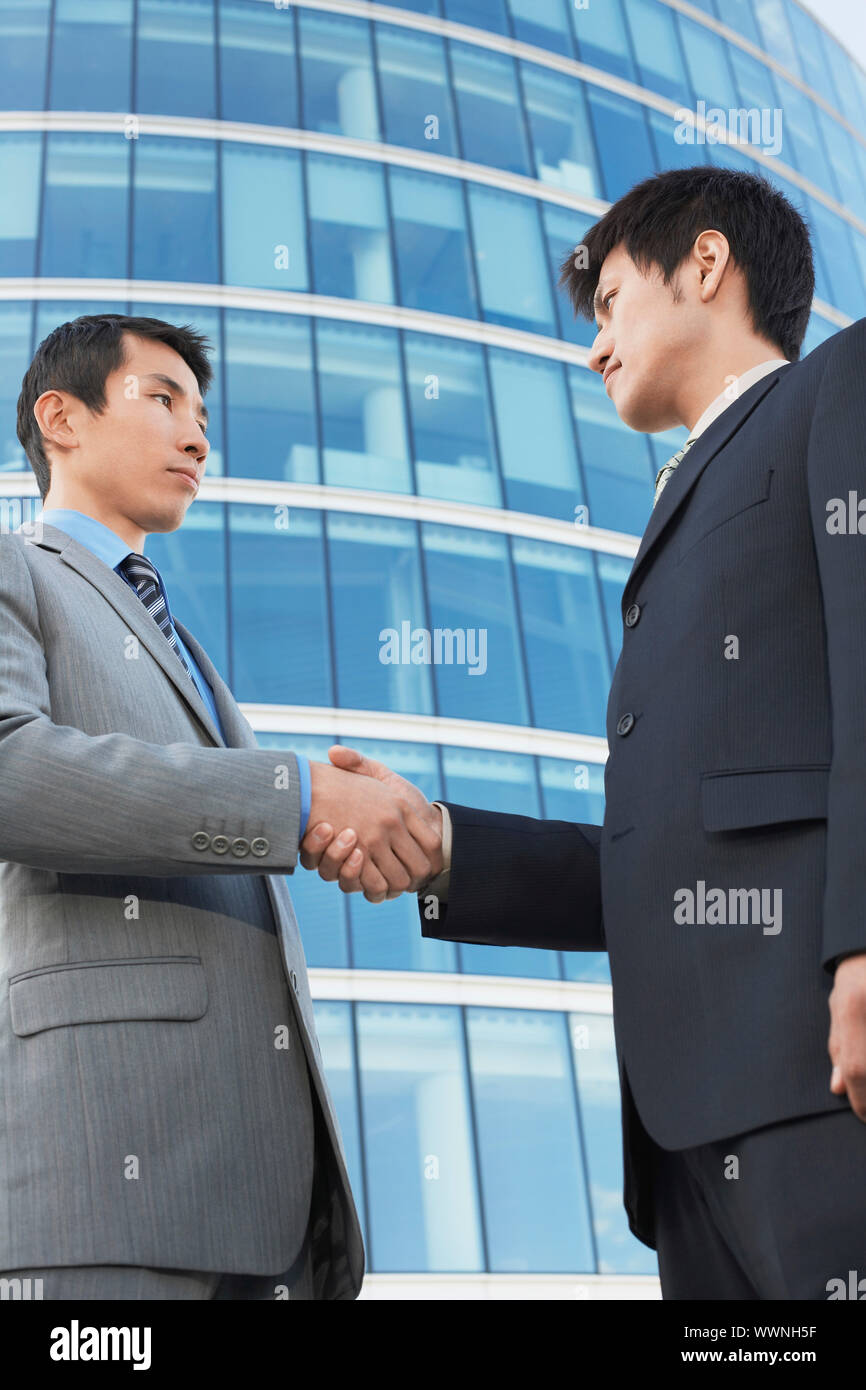 Businessmen Shaking Hands Stock Photo - Alamy