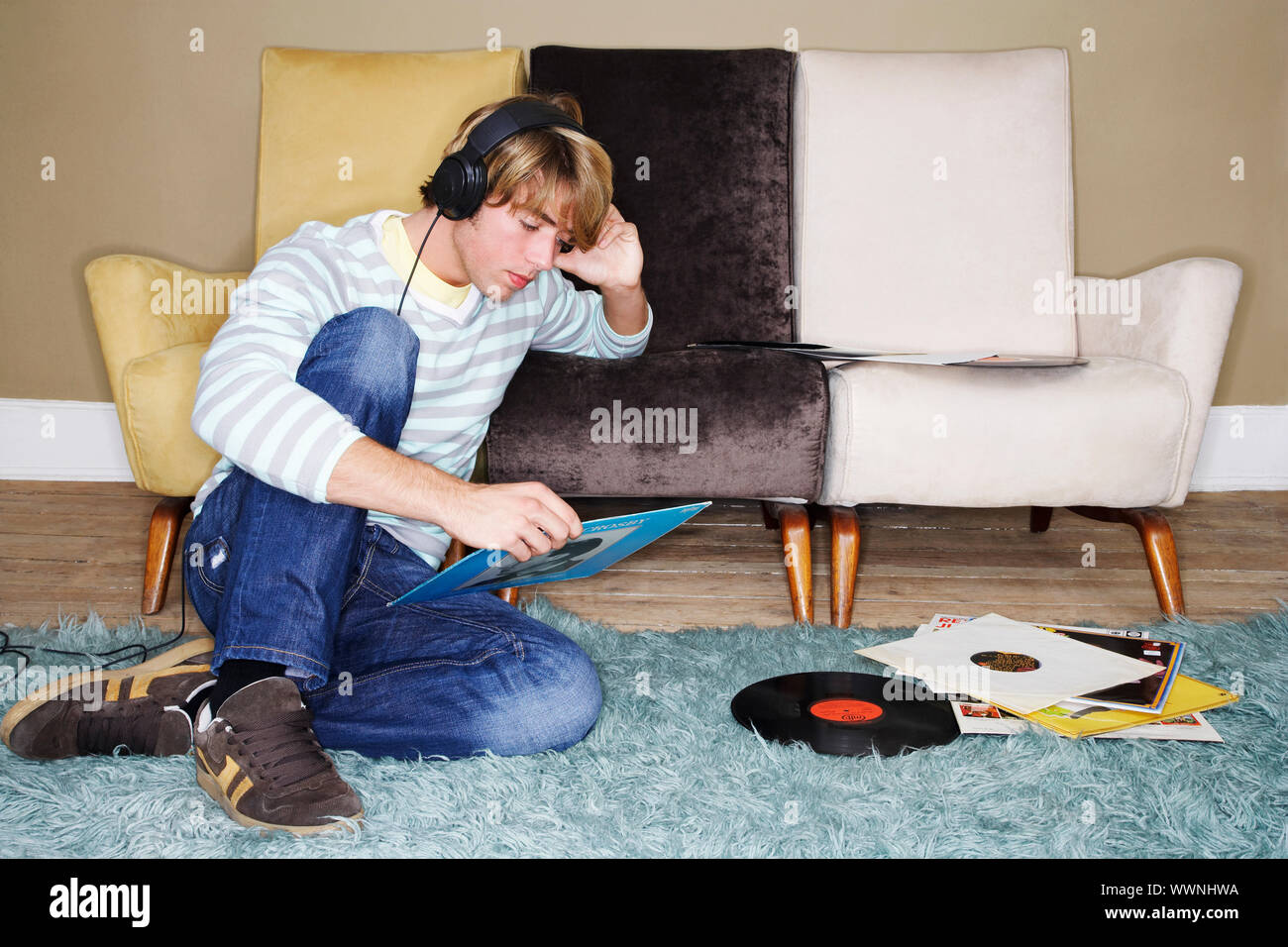 Young Man Listening to Records Stock Photo - Alamy
