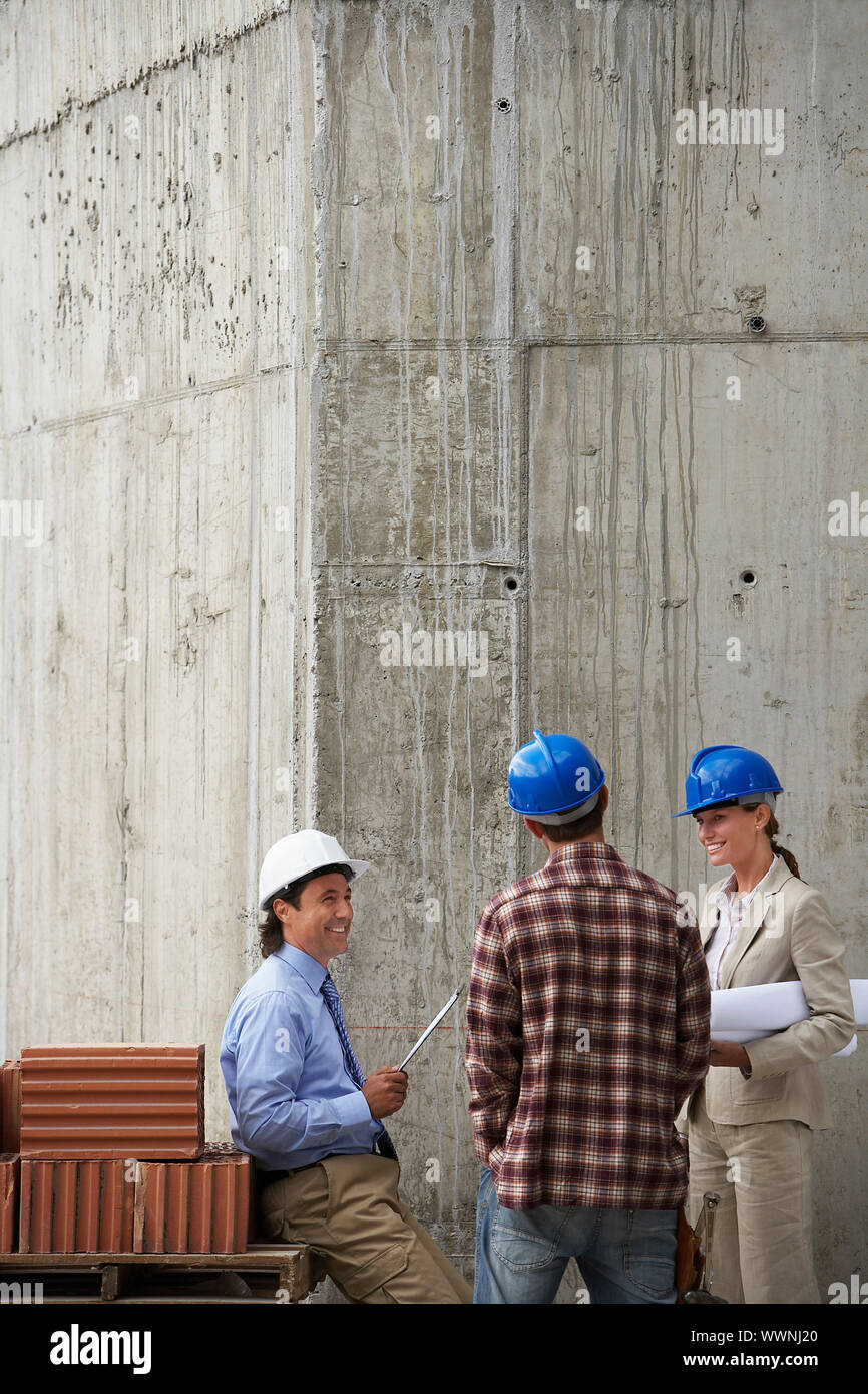People Talking at Construction Site Stock Photo - Alamy
