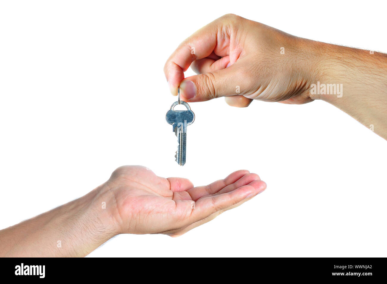 A male's hand giving a key to another male's hand Stock Photo - Alamy