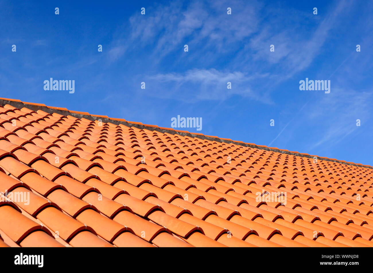 Orange roof tiles made from a ceramic material and the sky above Stock ...