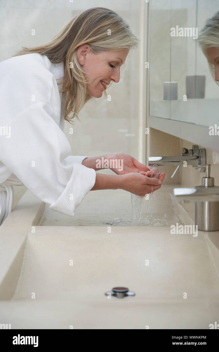 Woman Washing Her Face Stock Photo - Alamy
