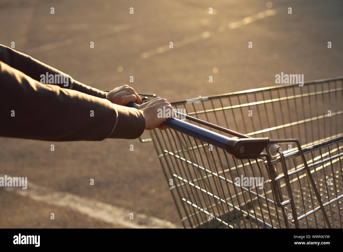 take cart in hands go shoping Stock Photo - Alamy