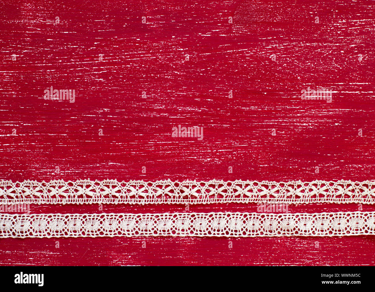 Cream vintage ribbons on the red aged wood Stock Photo - Alamy