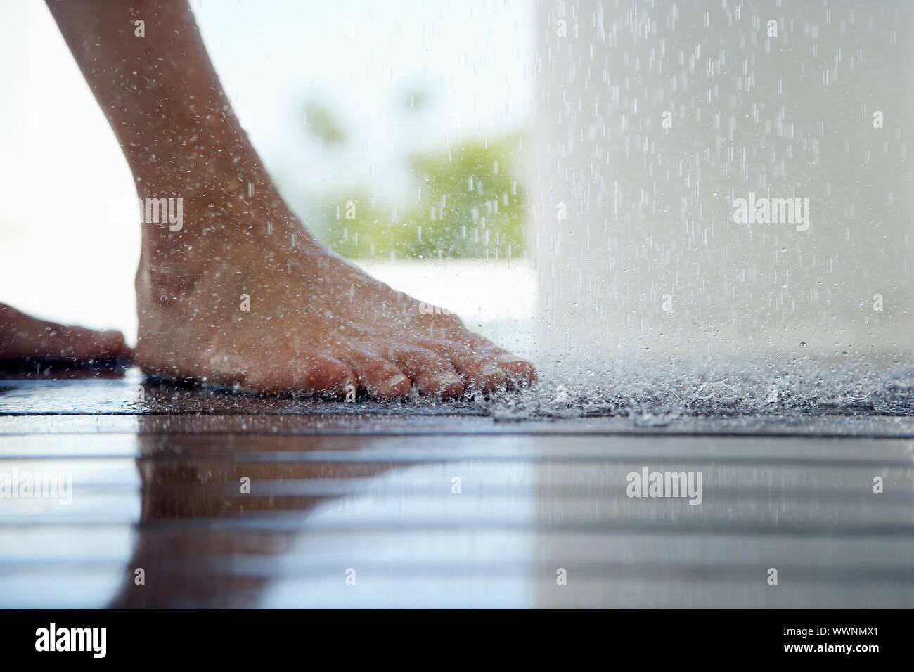Foot Under Dripping Water Stock Photo - Alamy