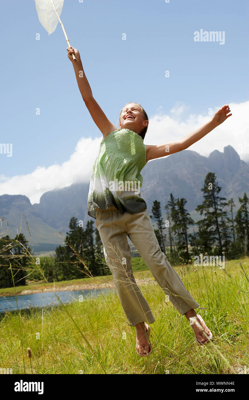 Girl Catching Bugs Stock Photo - Alamy