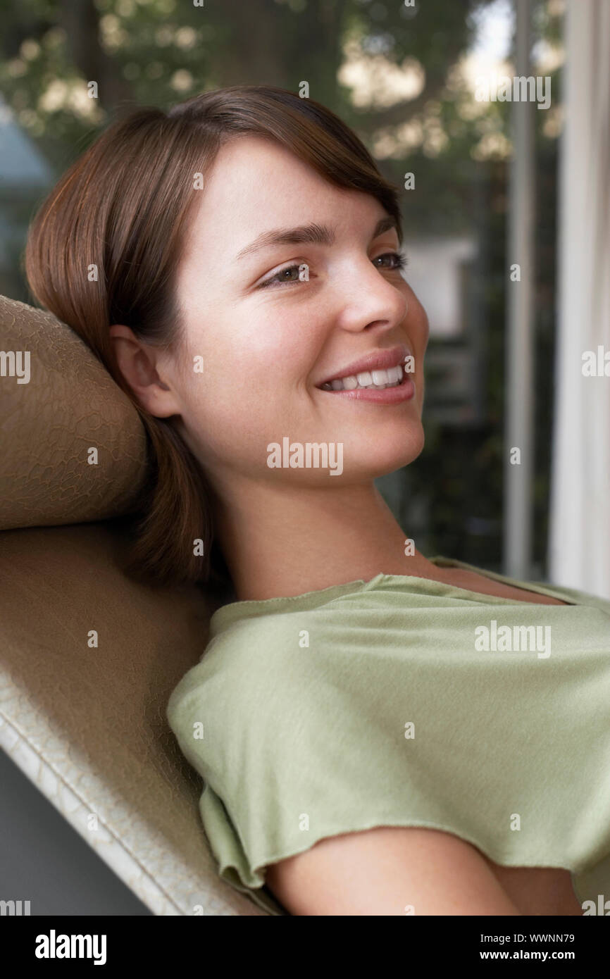 Woman Relaxing on Chair Stock Photo - Alamy