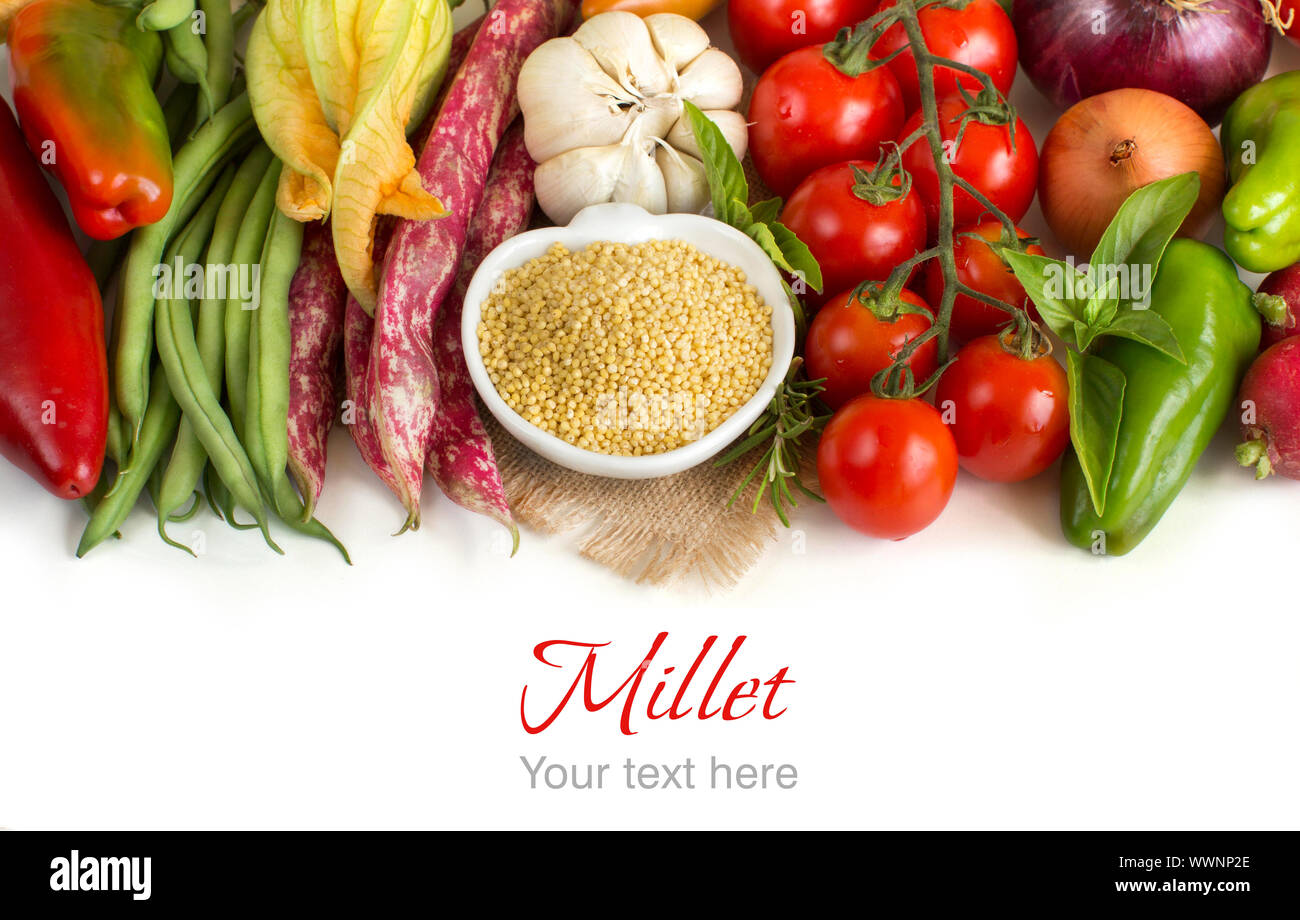 Raw millet in bowl and vegetables isolated on white Stock Photo - Alamy
