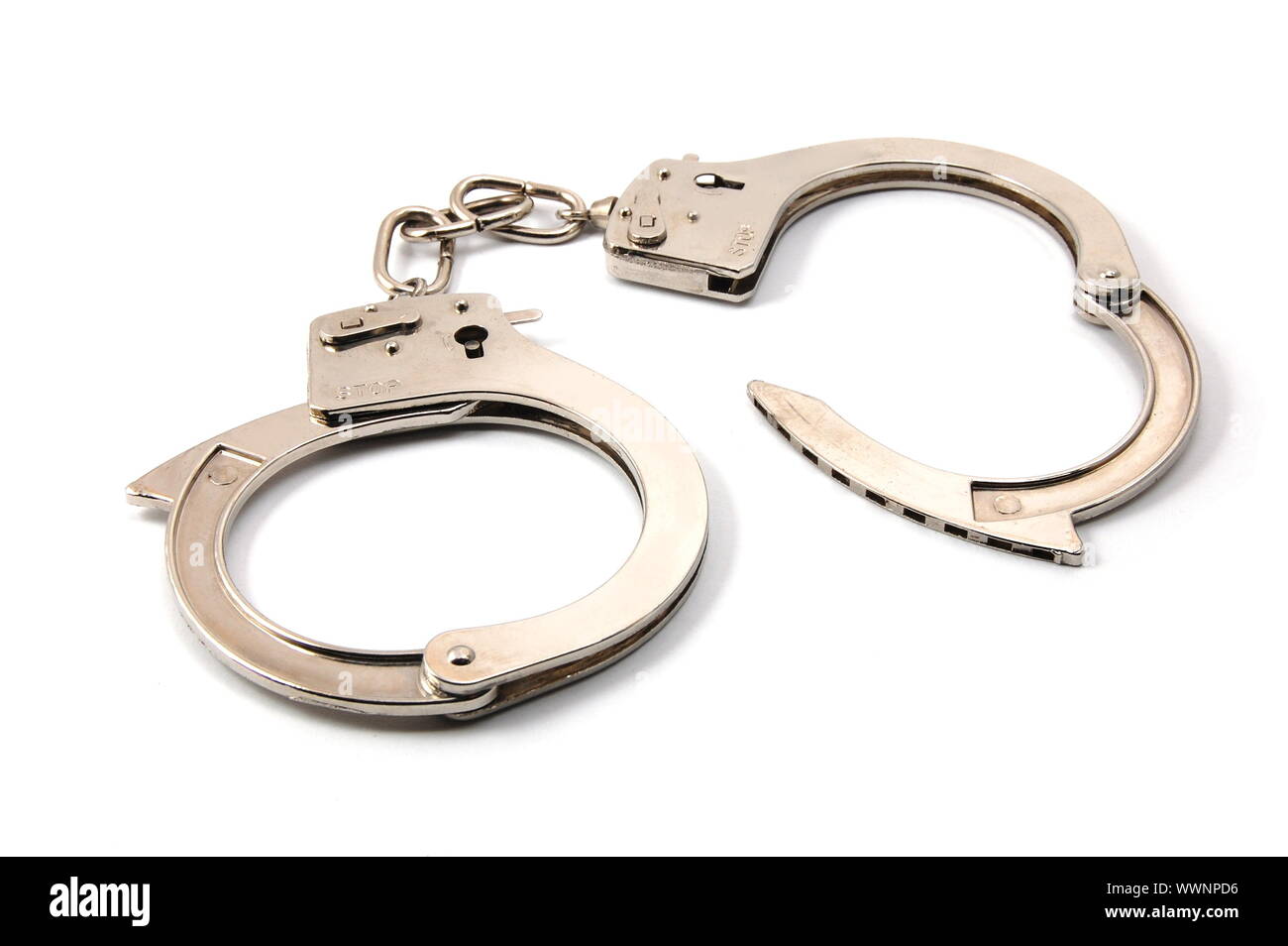 police handcuffs isolated on a white background Stock Photo - Alamy