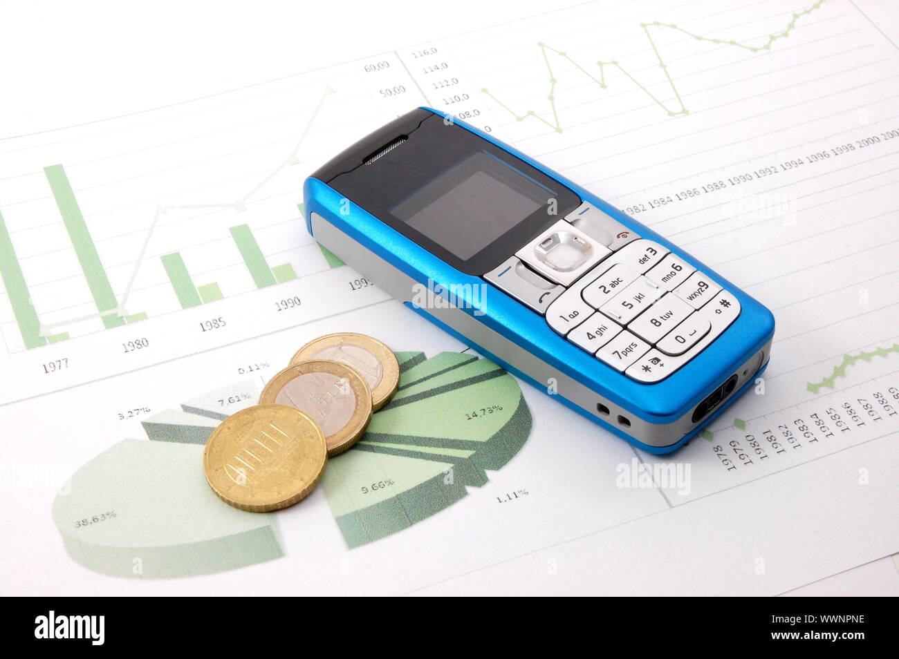 blue cell phone over business chart showing success Stock Photo - Alamy