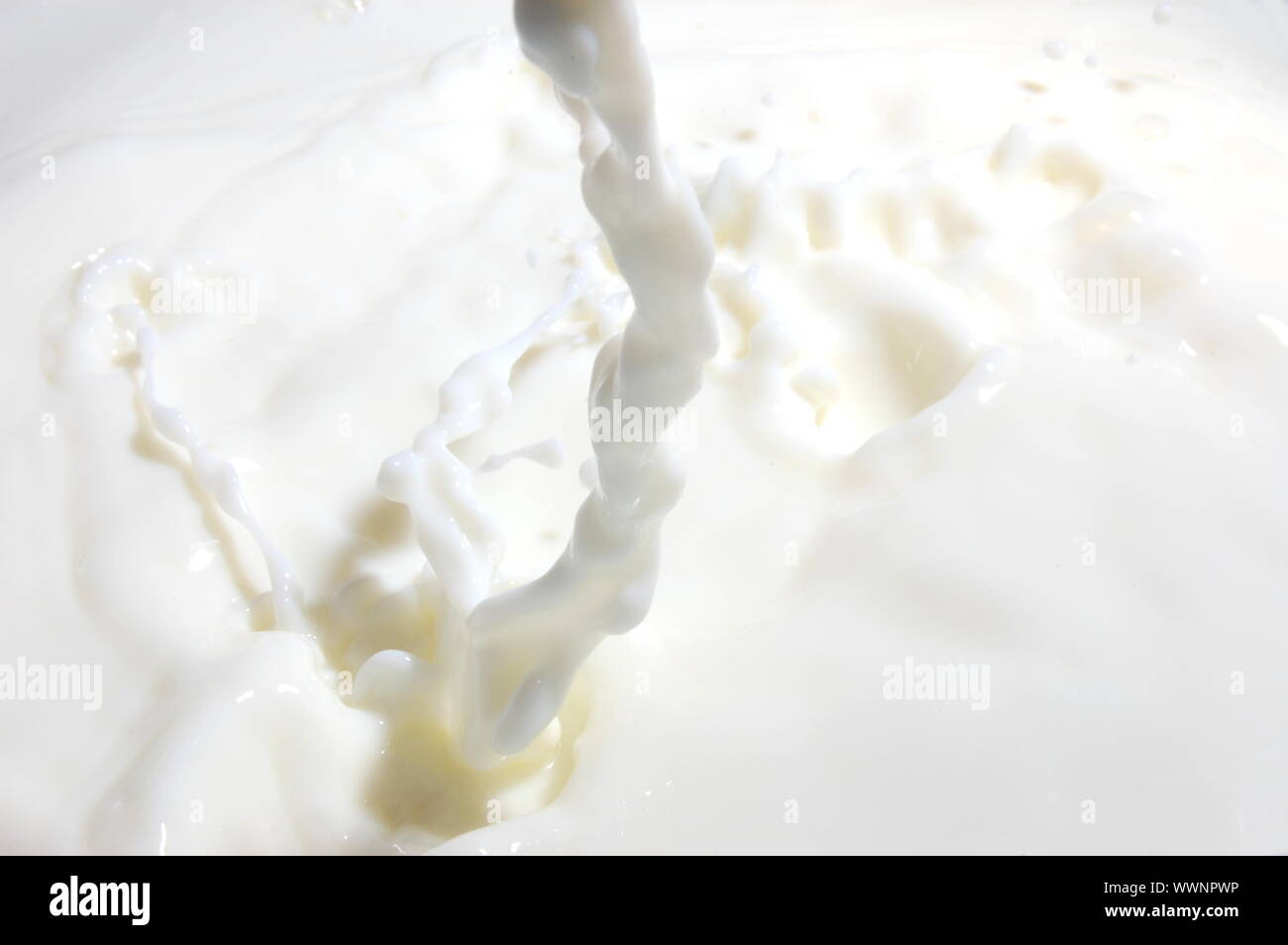 Dropping milk white liquid drops hi-res stock photography and images ...