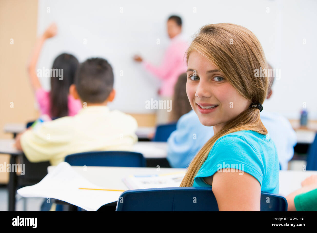 Female pupil in elementary school classroom Stock Photo - Alamy