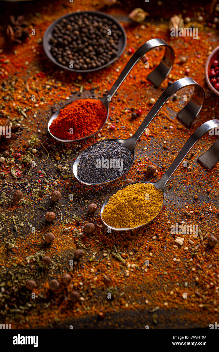 Aromatic spices in metal aspoons. Spice concept Stock Photo - Alamy