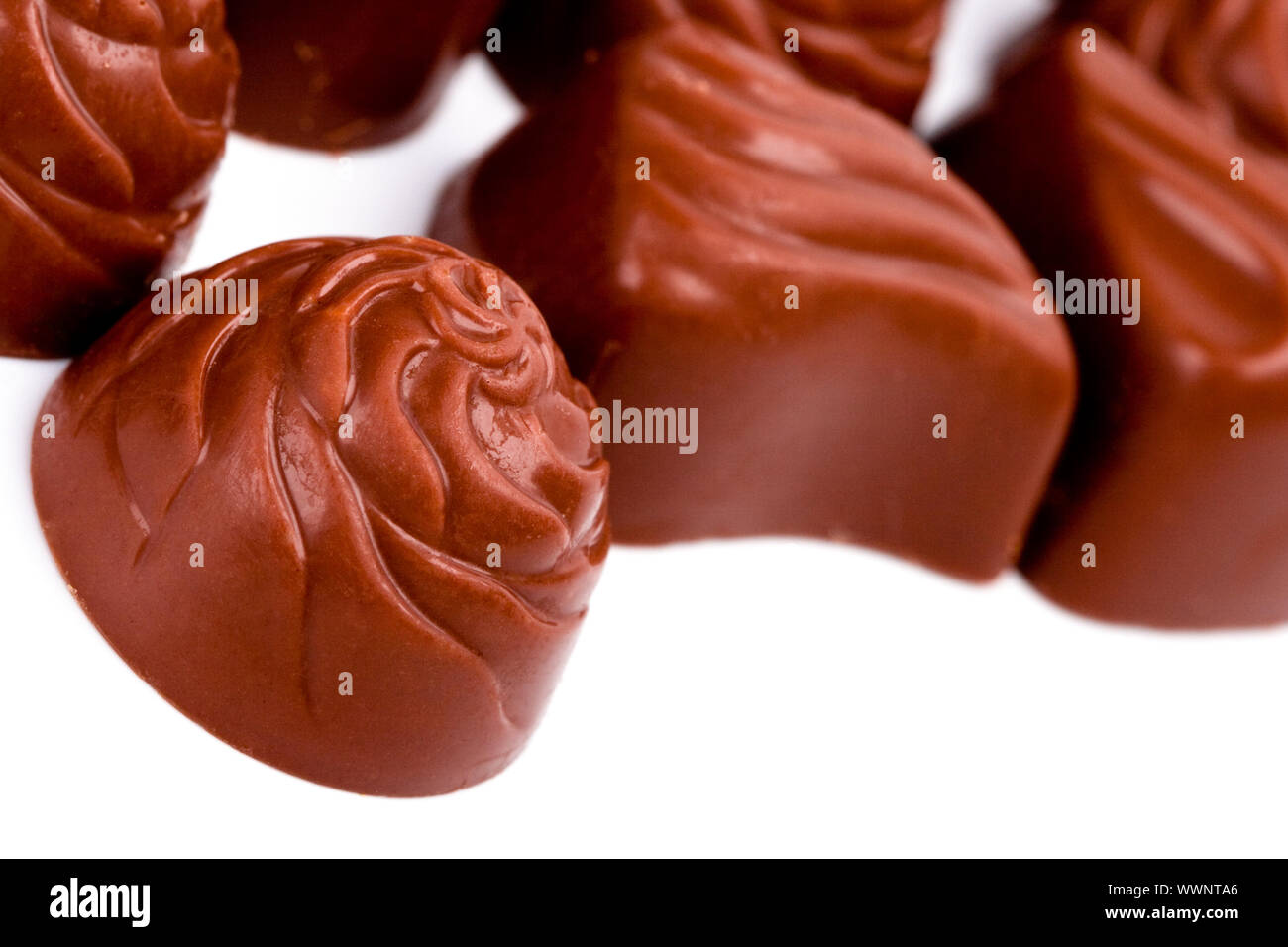 chocolate sweets closeup on a white background Stock Photo - Alamy
