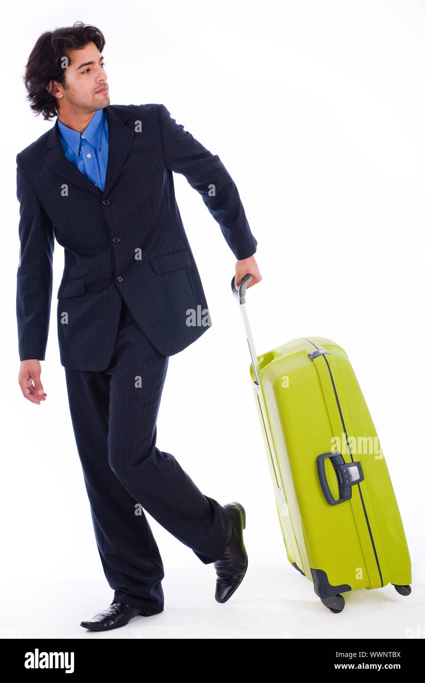 Corporate man looking back with the luggage in isolated white ...