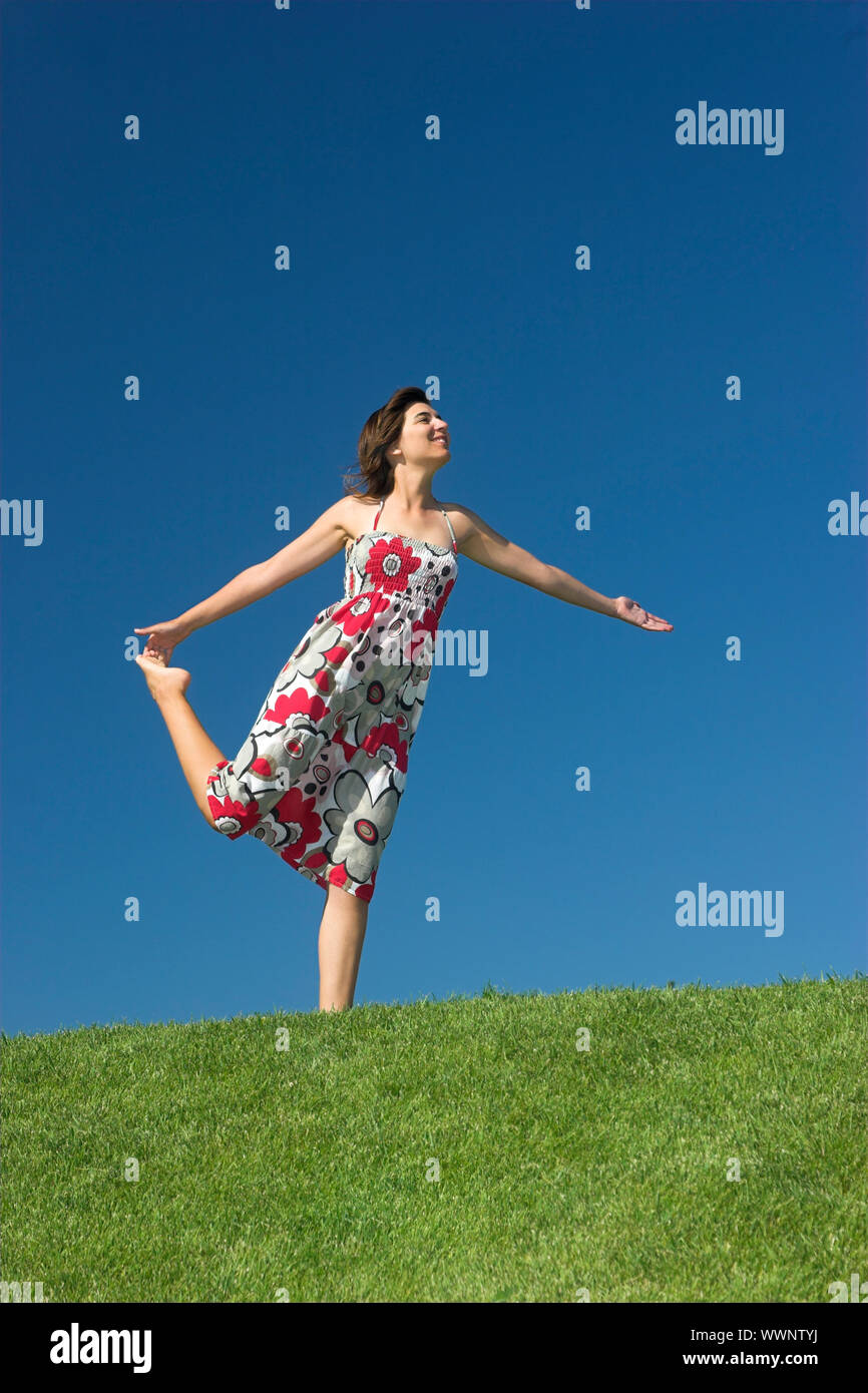 Happy woman having fun on a beautiful green meadow Stock Photo - Alamy