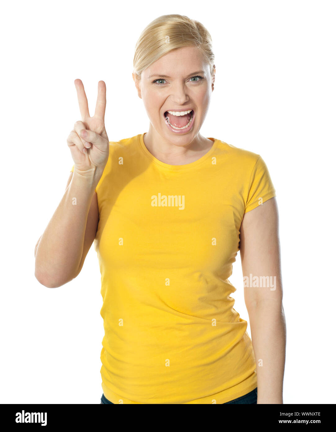 Young and beautiful teenage girl doing victory sign isolated on white ...