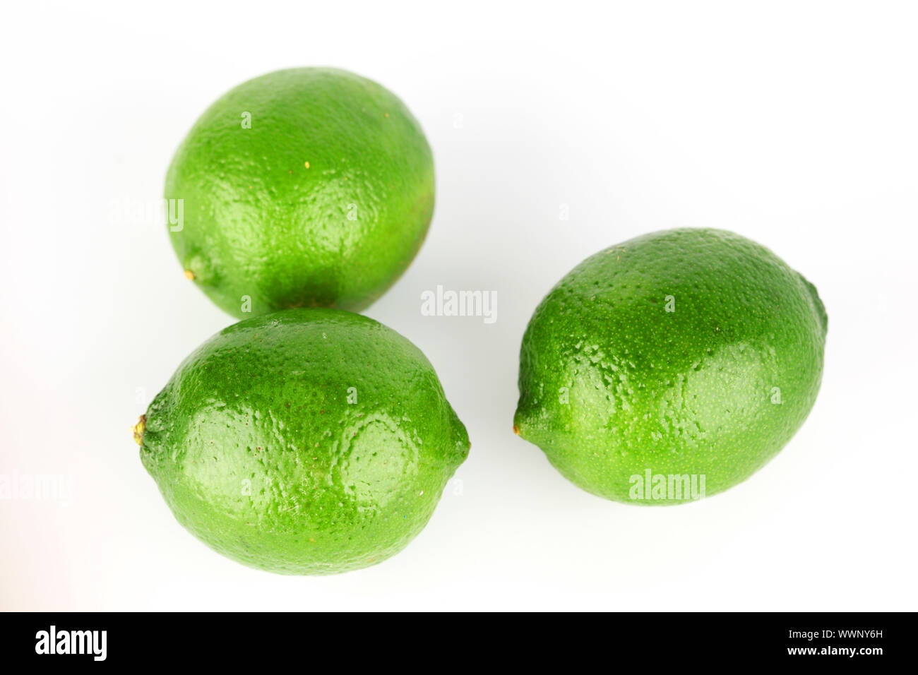 lime pile isolated on white background Stock Photo - Alamy
