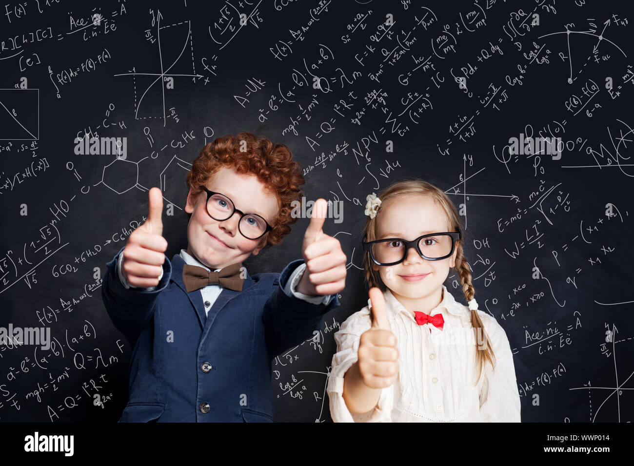 Smart children student having fun on blackboard background with science ...