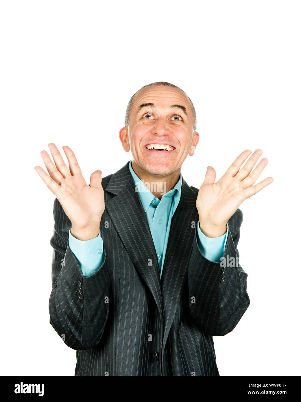 Portrait of happy man looking up in amazement isolated on white ...
